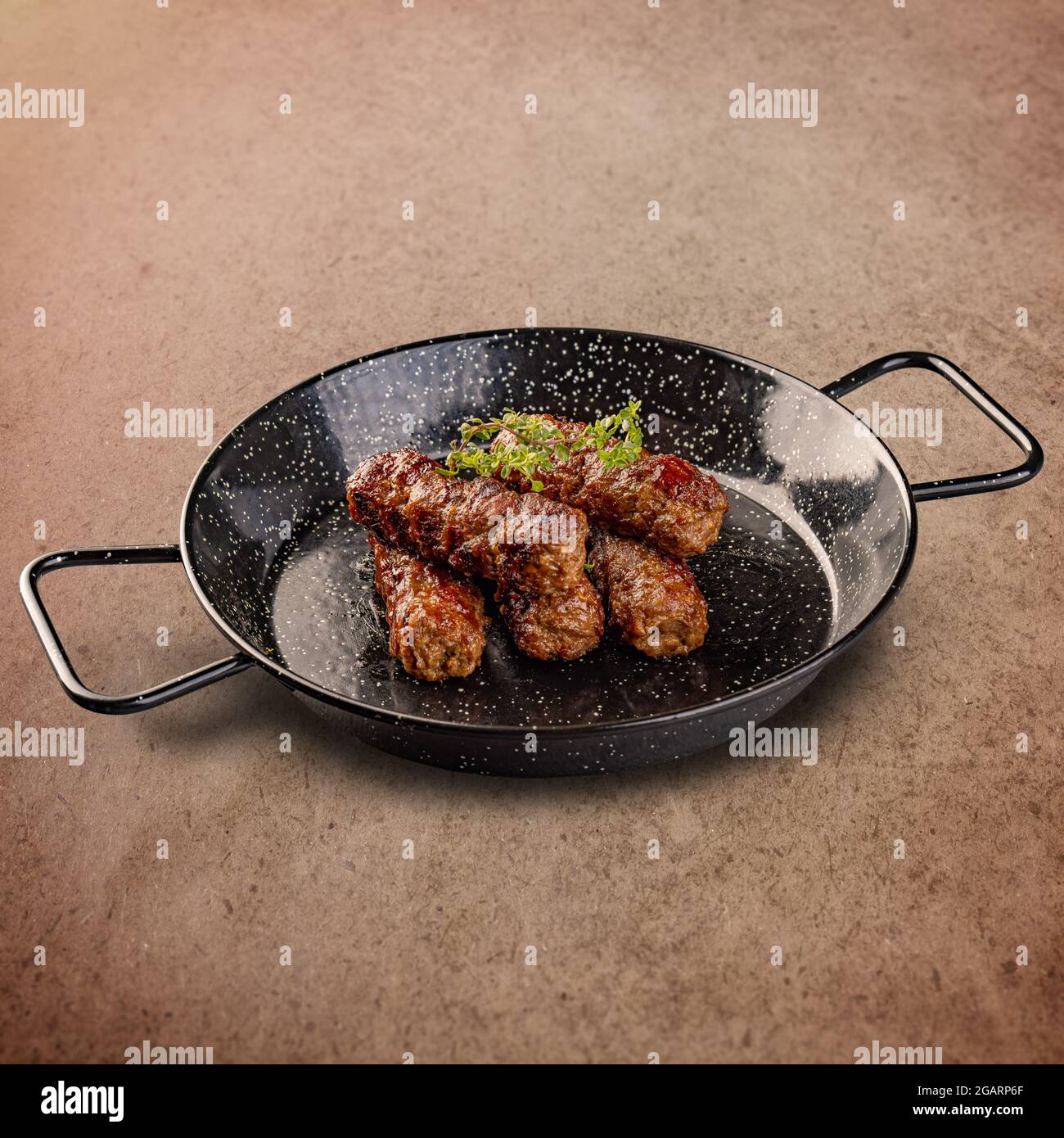 Juicy grilled rolls of minced meat named kofte or cevapcici Stock Photo ...