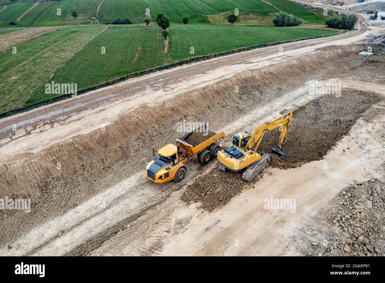 Aerial photo of an excavator and truck working on a construction Stock ...