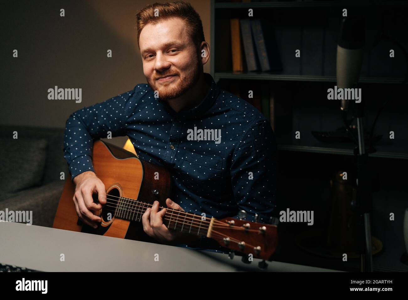 Smiling close up looking up sitting performance hi-res stock ...