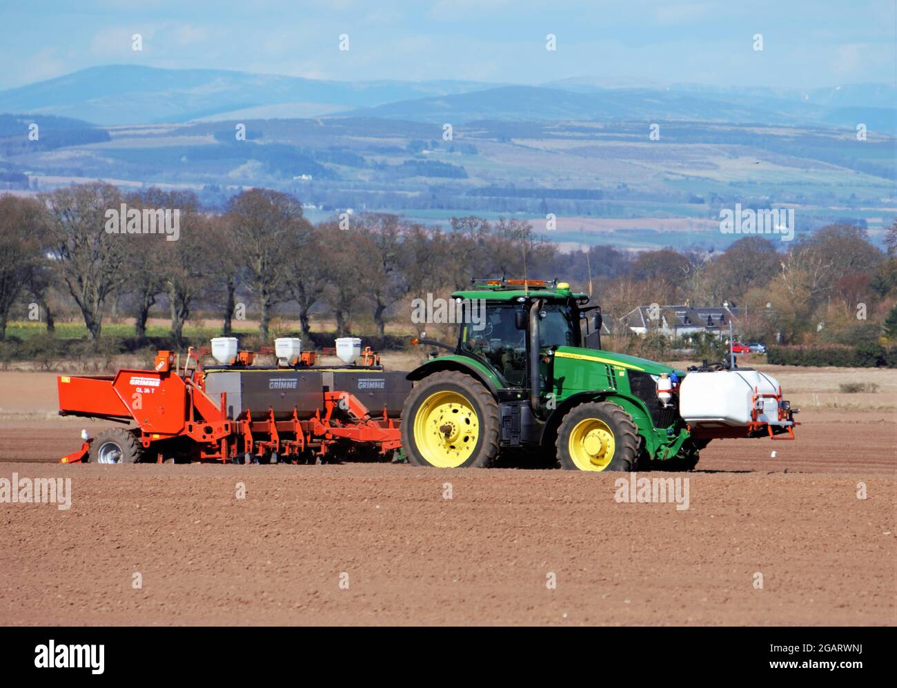Tractor destoning and planting potatoes, Perthshire, Scotland - potato ...
