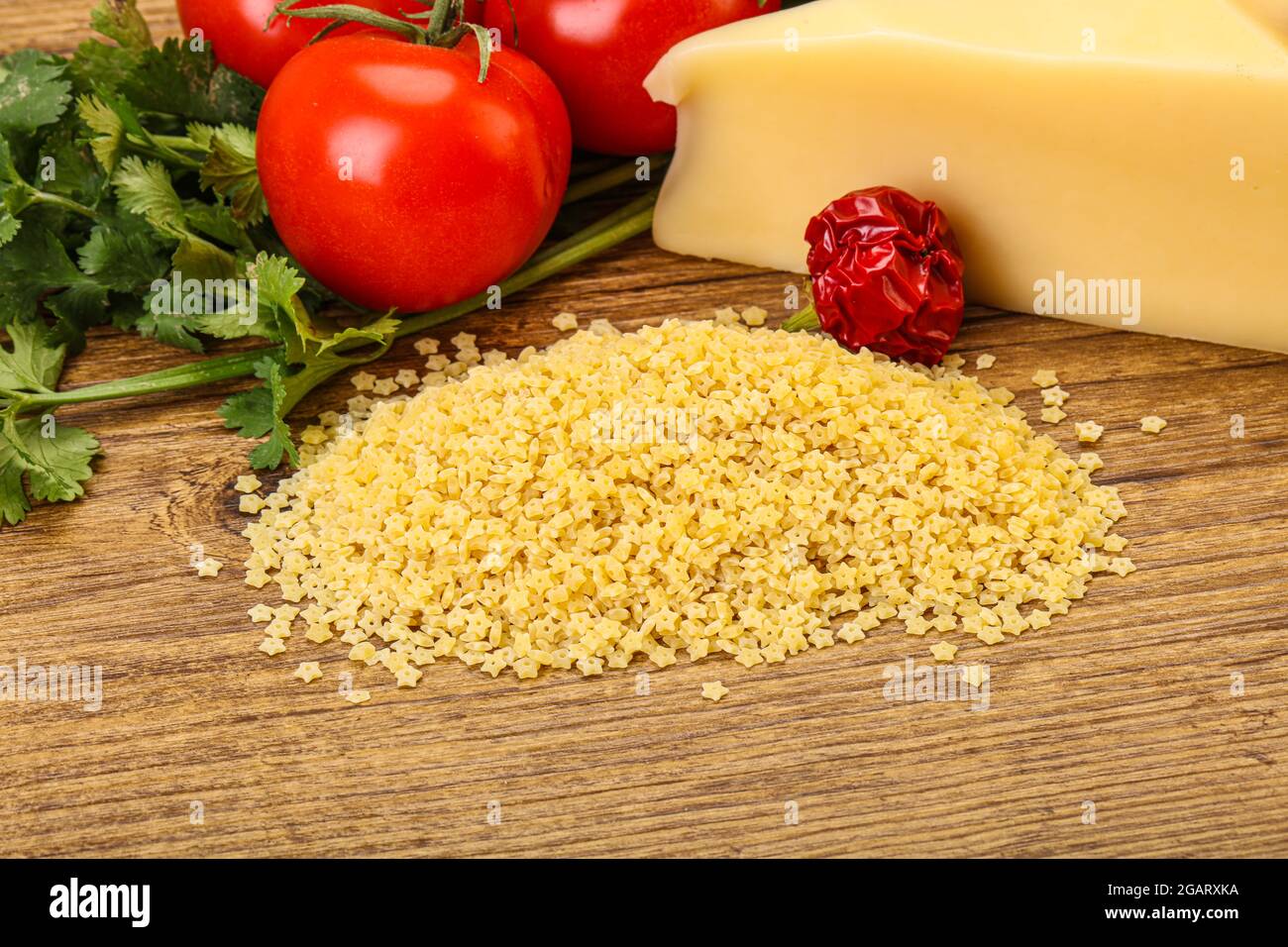 Raw Italian pasta - Stelline for cooking served vegetables Stock Photo ...