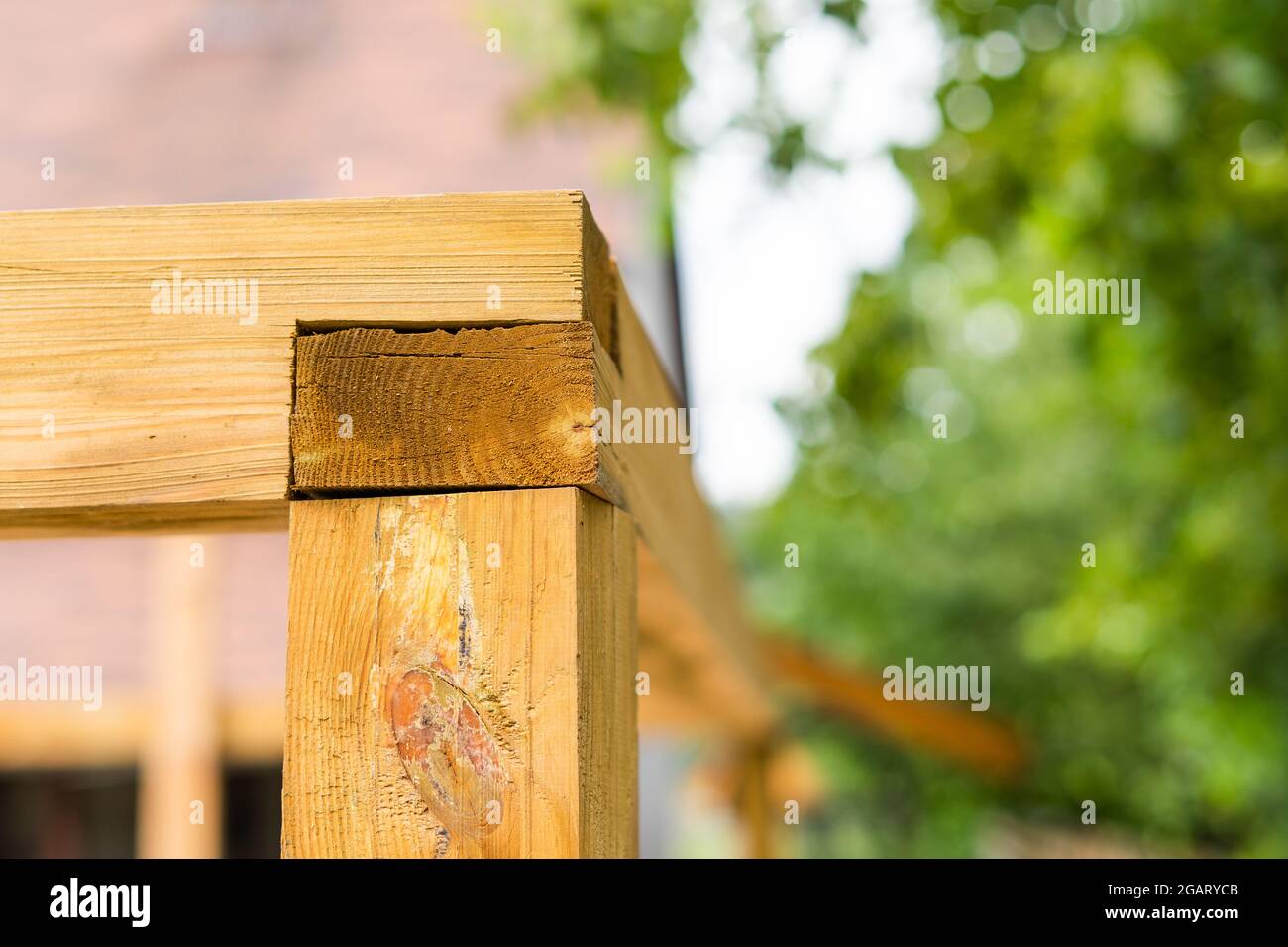 Corner connection of timber beams in frame buildings Stock Photo - Alamy