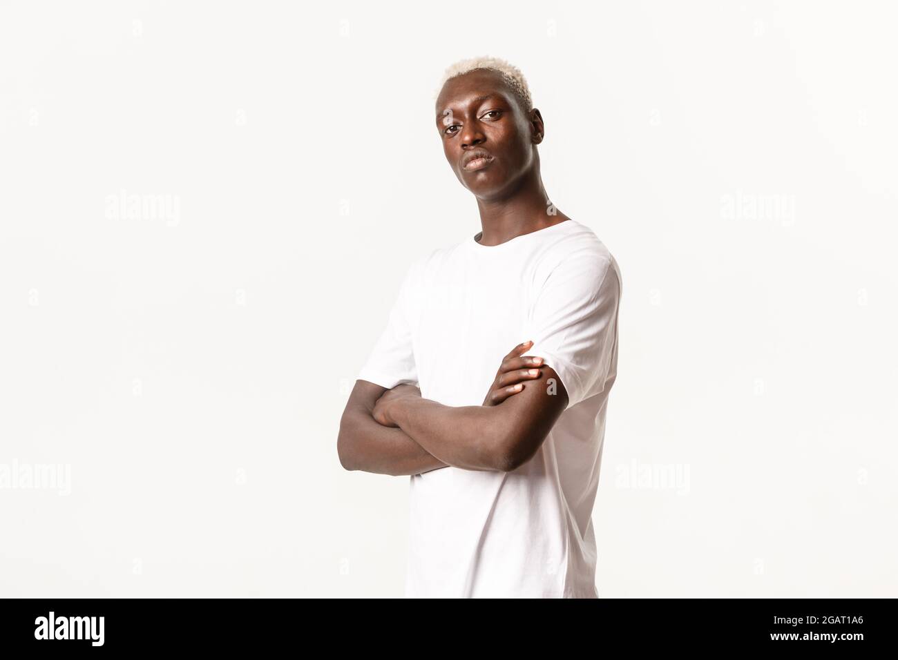 Portrait of confident assertive african-american guy with blond hair ...
