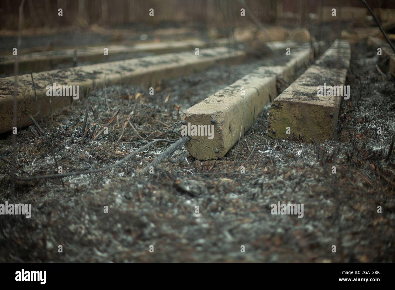 Concrete beams on the ground. Build materials after a fire. Remains on ...