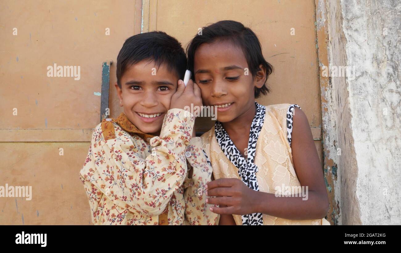Indian kids talking mobile hi-res stock photography and images - Alamy