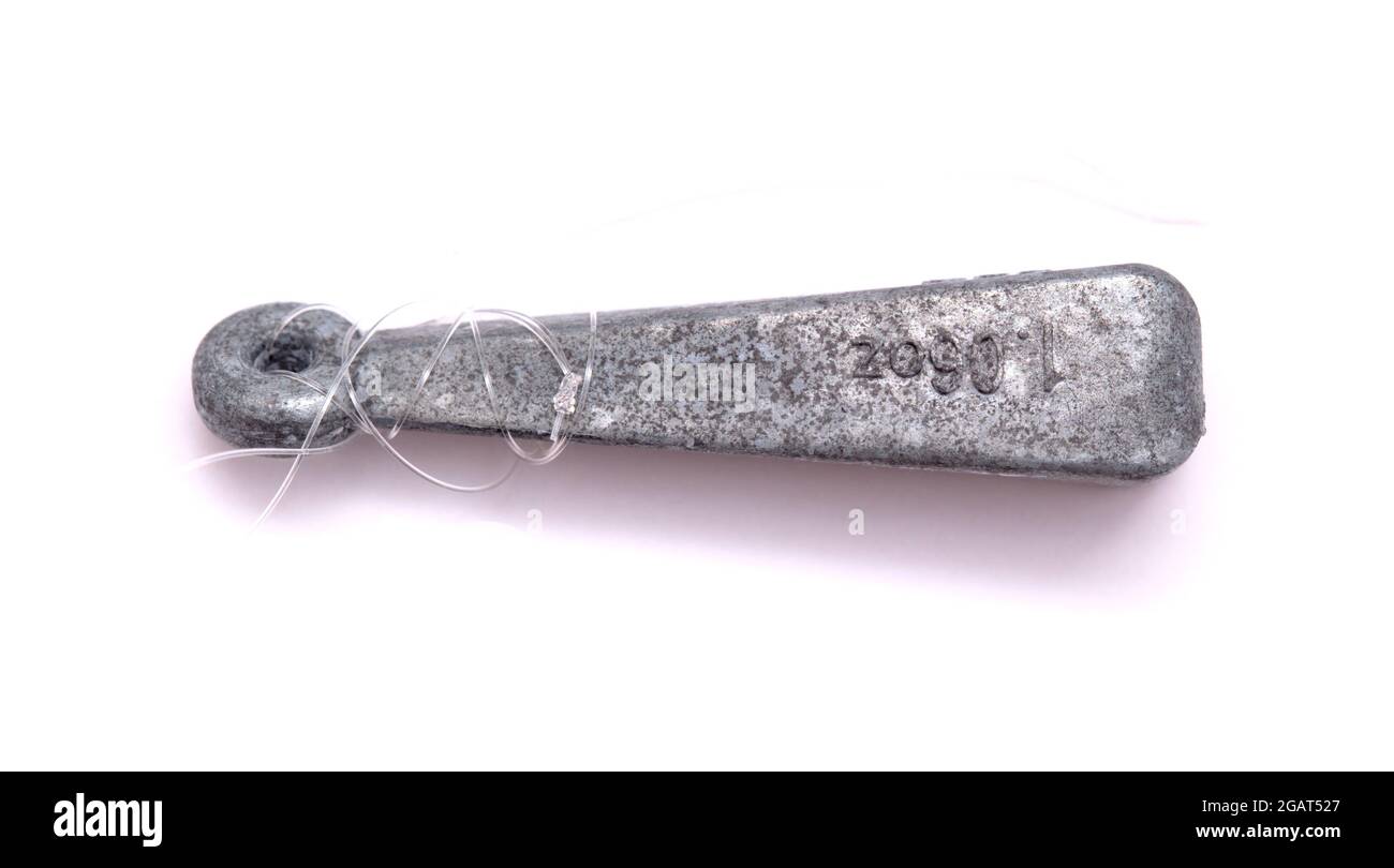 Old lead sinker with a bit of line still attached, isolated on white ...