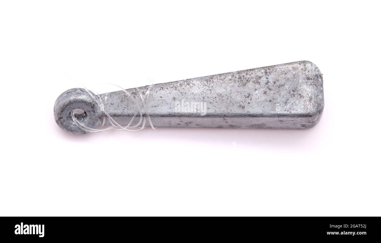 Old lead sinker with a bit of line still attached, isolated on white ...