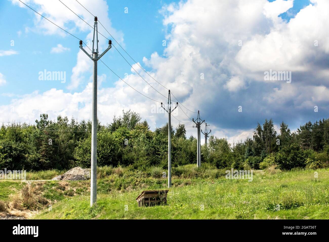 Power lines in the countryside. Sky with clouds. Energy distribution in ...