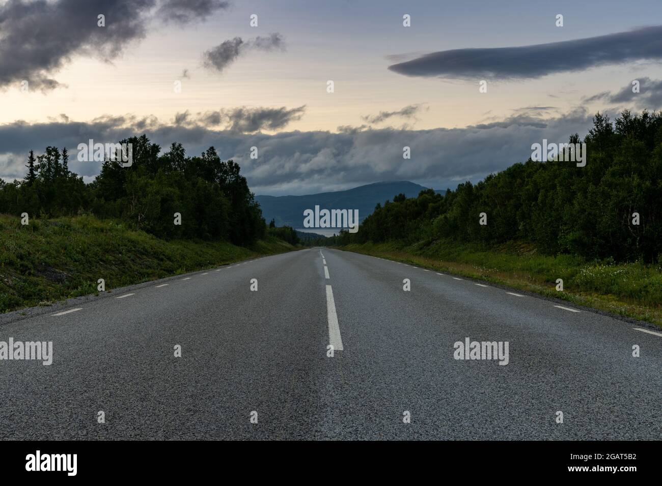 low angle view of a paved highway leading straight to the horizon in ...
