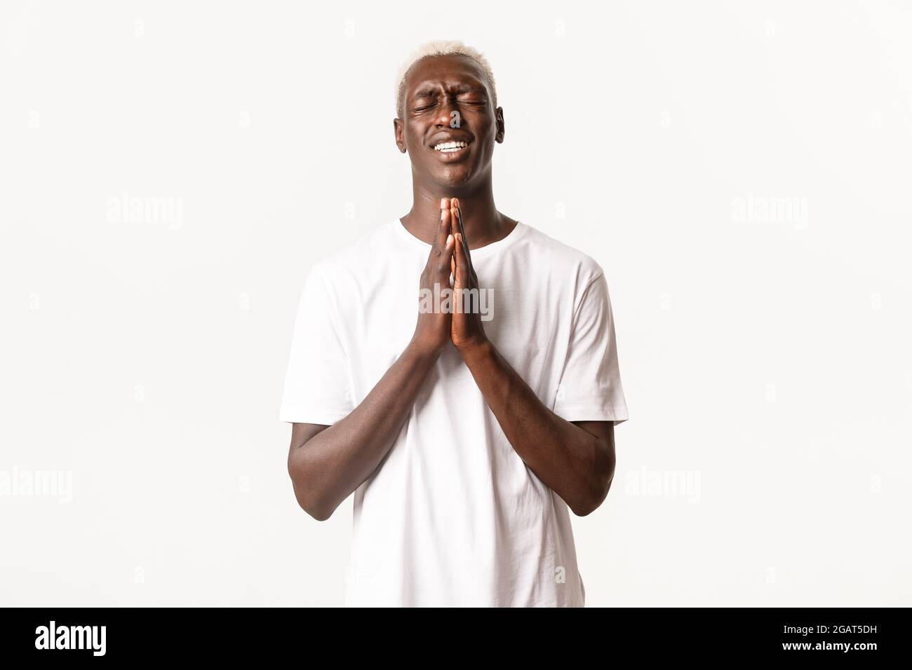 Portrait of miserable blond african-american guy, begging or pleading ...