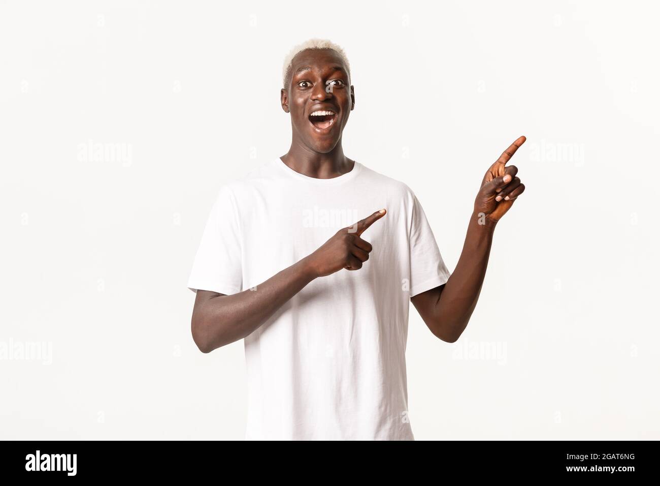 Portrait of surprised and excited african-american guy, looking ...
