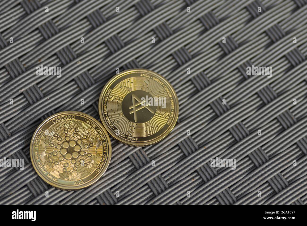 two golden ada coins from cardano currency front and back view oblique ...