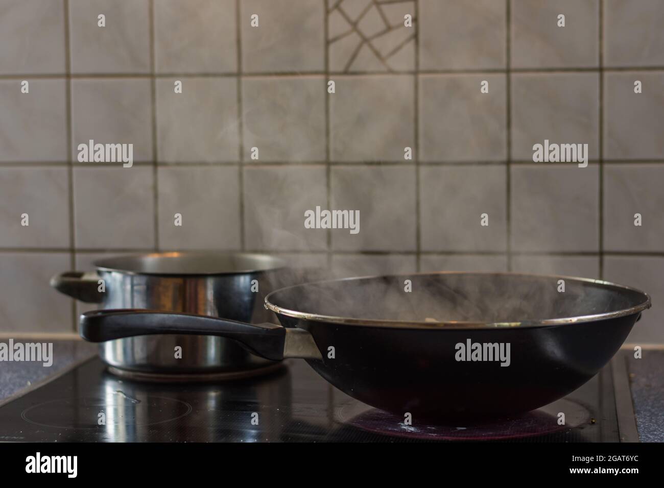 smoking pots in a kitchen while cooking Stock Photo - Alamy