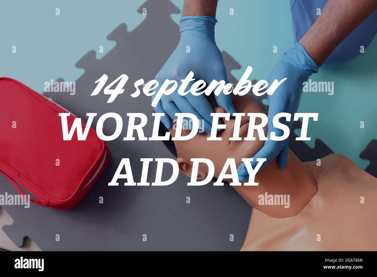 Instructor demonstrating CPR on mannequin. World First Aid Day Stock ...