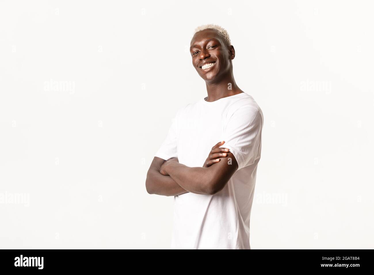 Portrait of handsome confident african-american blond guy, cross arms ...