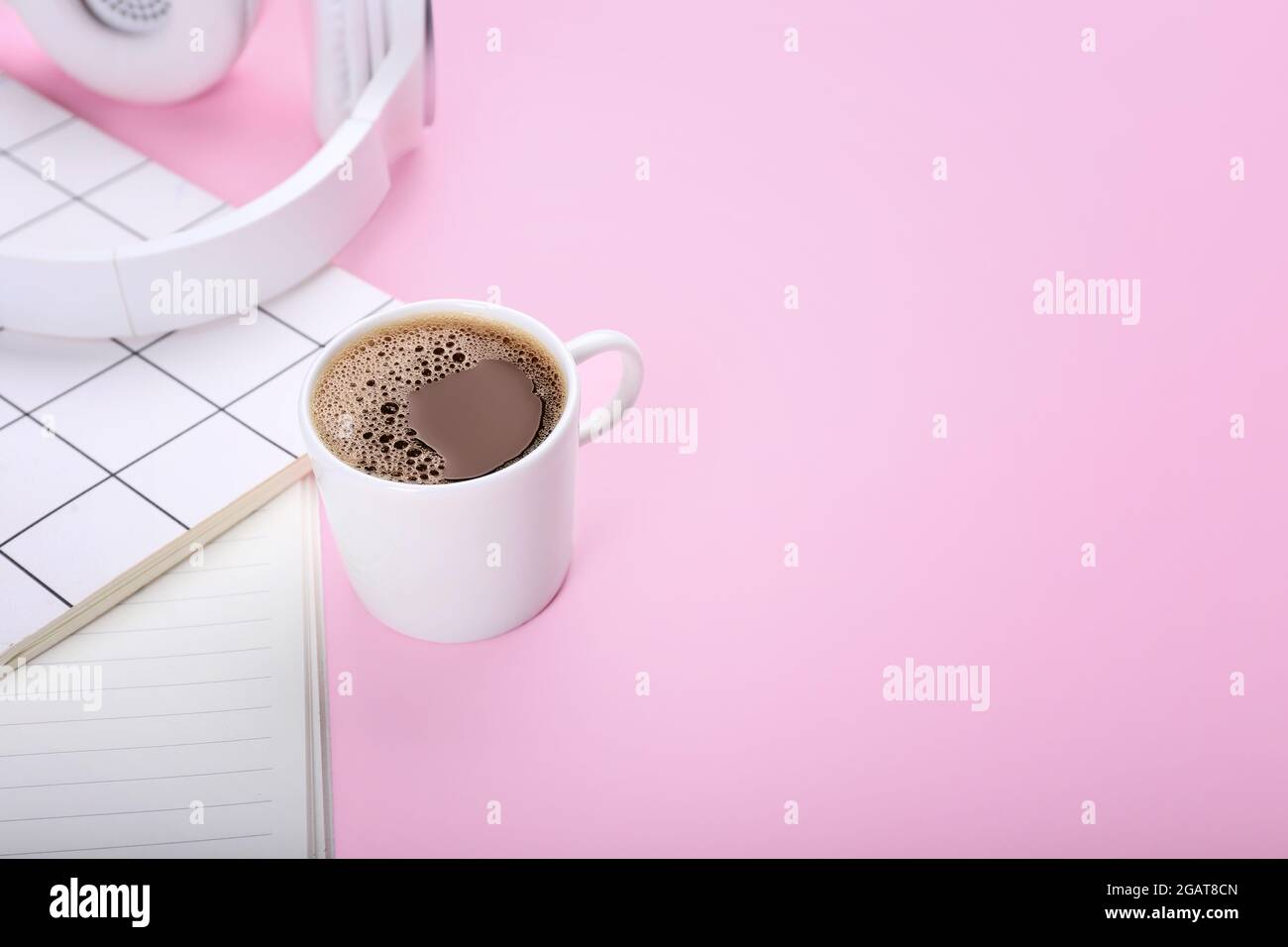 Cup of coffee, headphones and notebooks on color background Stock Photo ...