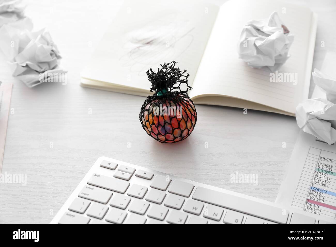 Stress ball on table in office Stock Photo - Alamy