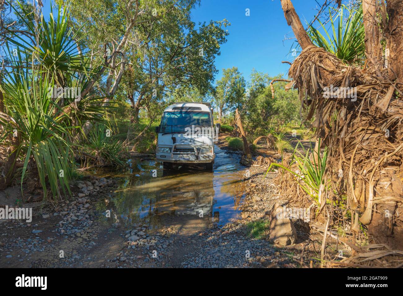 Toyota Coaster bus motorhome crossing a creek in the Outback ...