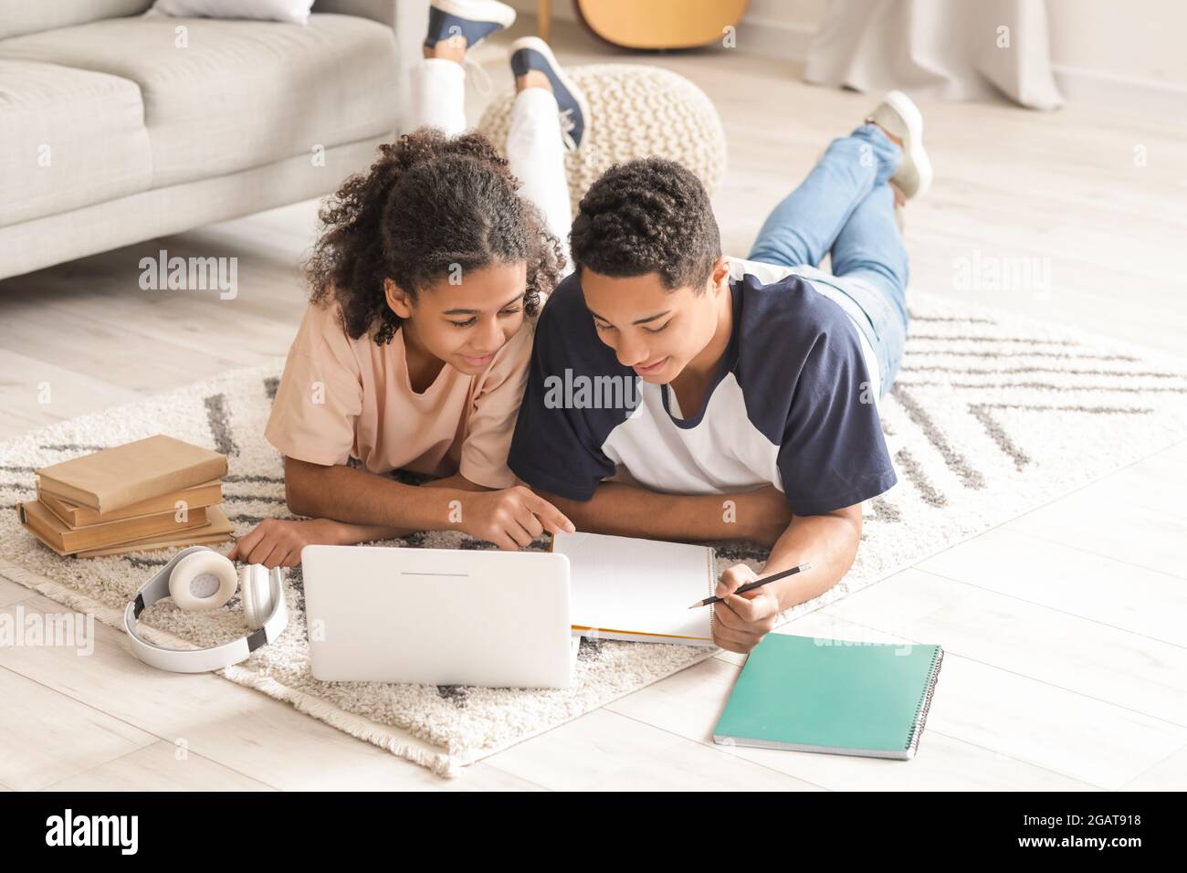 African-American brother and sister studying at home Stock Photo - Alamy