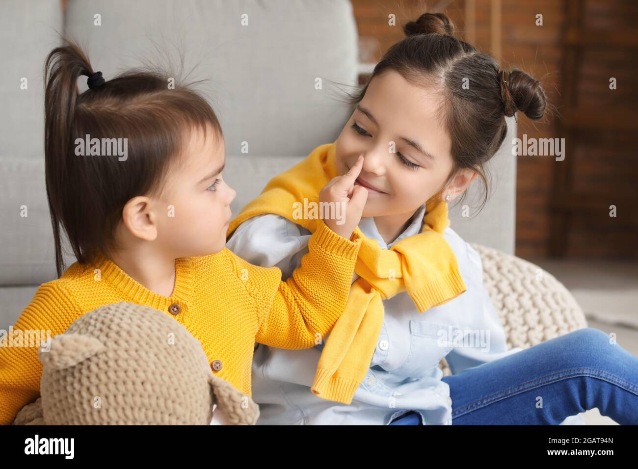 Beautiful girl playing younger sister hi-res stock photography and ...