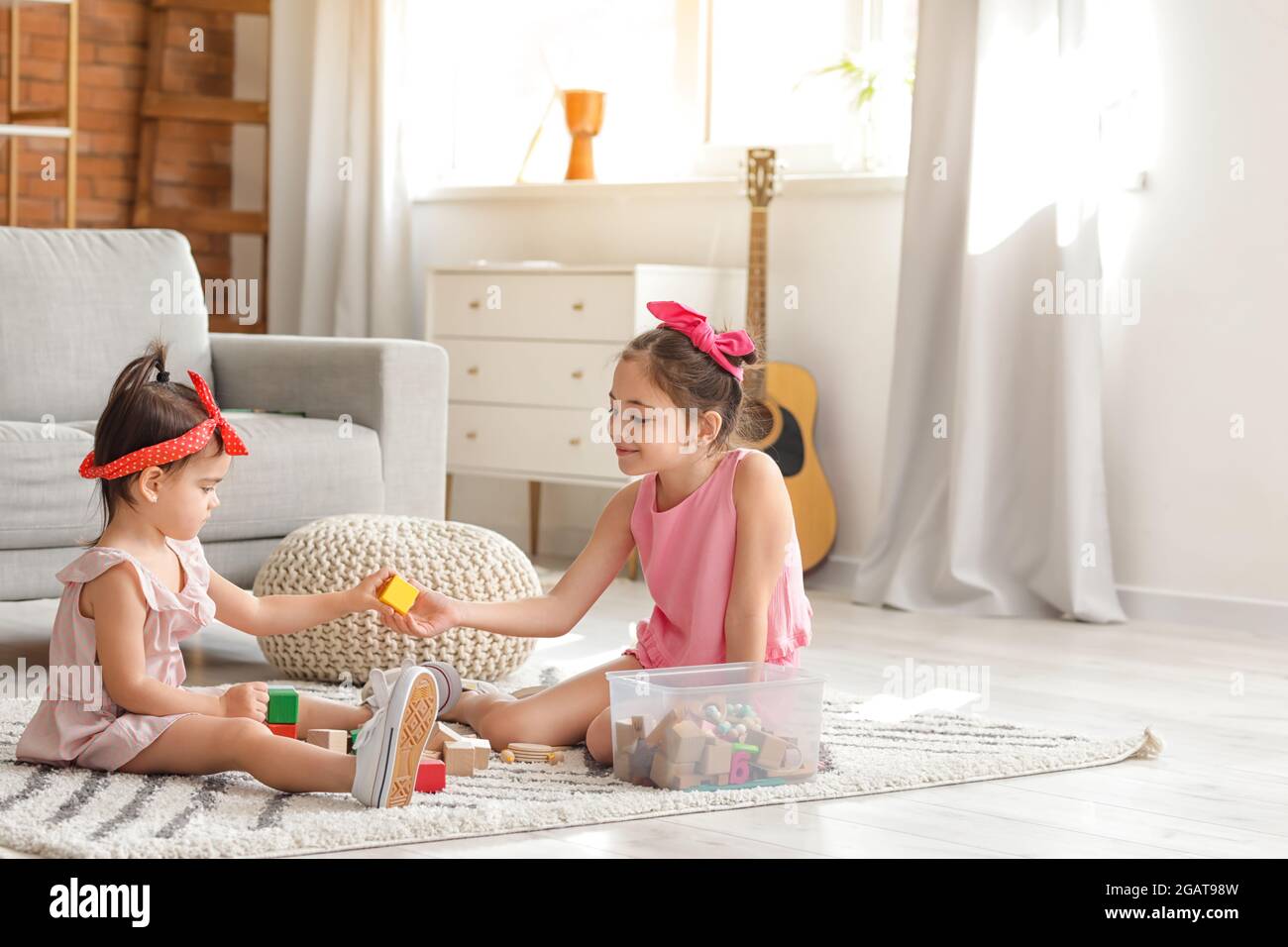 Beautiful girl playing younger sister hi-res stock photography and ...
