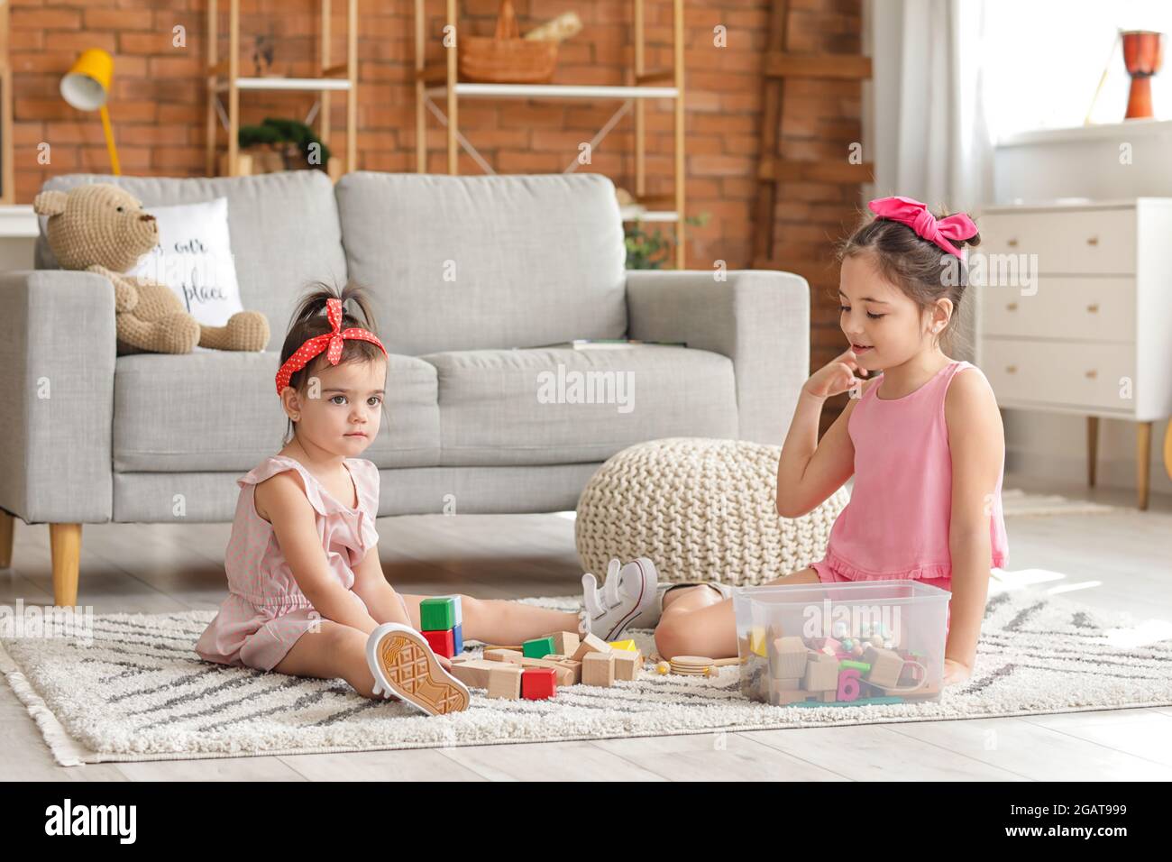 Cute little sisters playing at home Stock Photo - Alamy