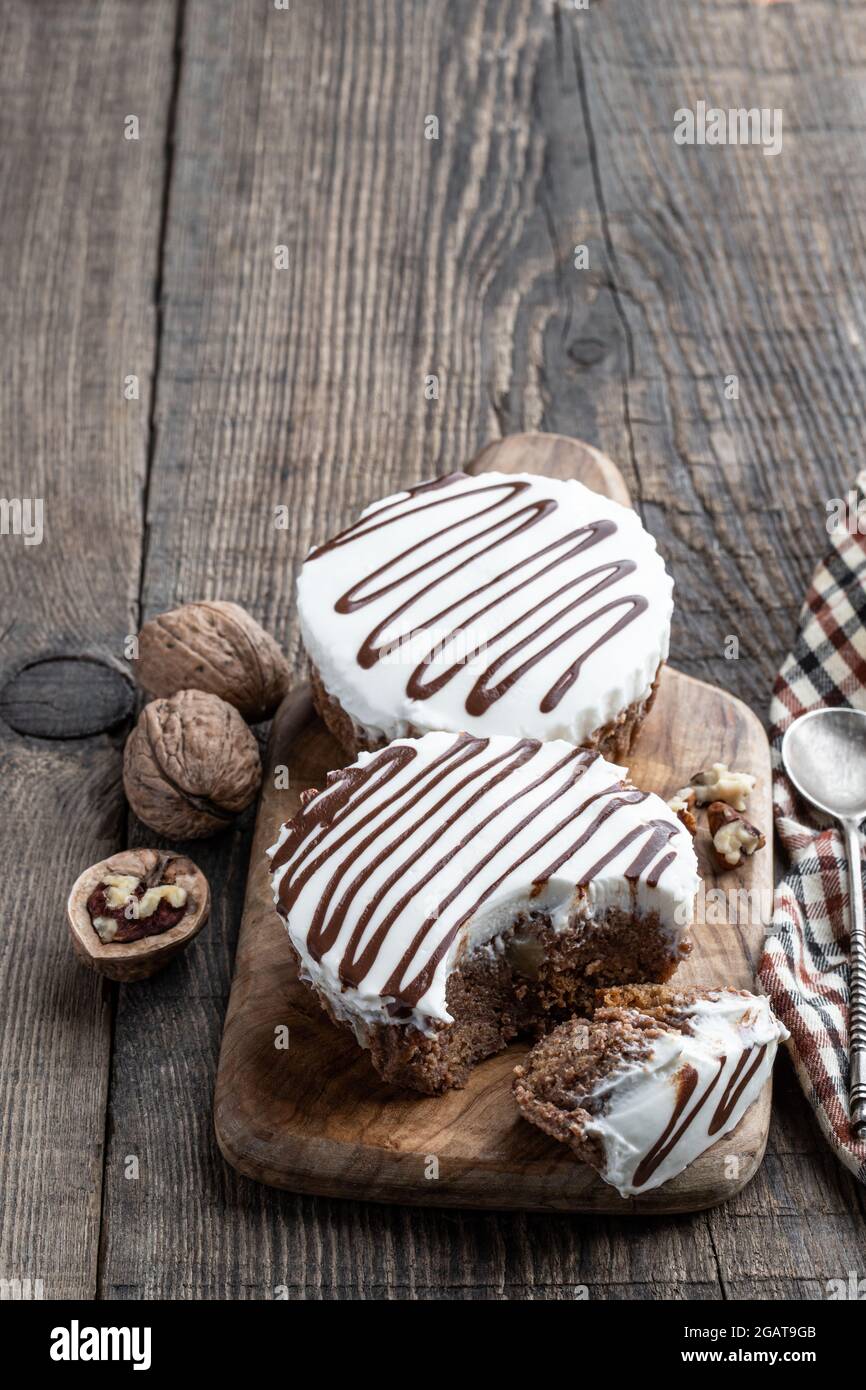 decorated sponge cake on wooden table with cup of coffee and spoon ...