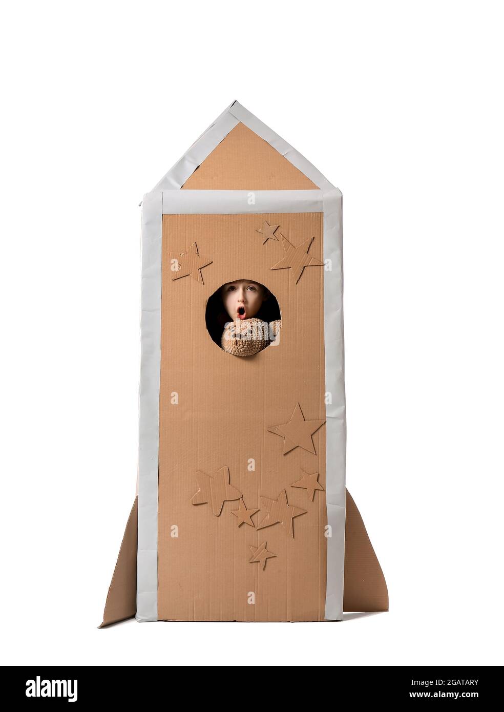 shocked little boy in cardboard rocket on white background Stock Photo ...