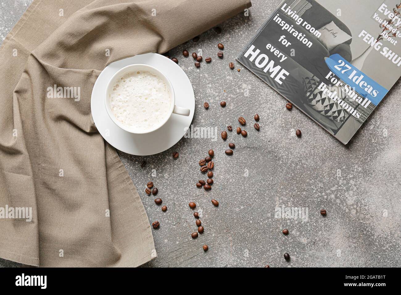 Cup of coffee with beans and magazine on grunge background Stock Photo ...