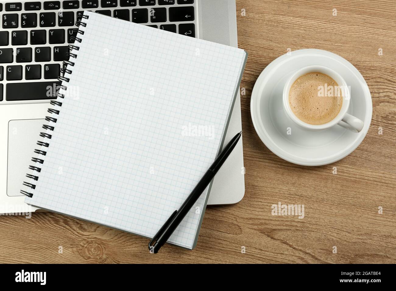 Empty notebook on laptop keyboard, on light background Stock Photo - Alamy