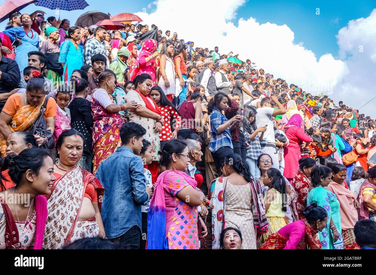 Crowds of Nepalese people gathered on the stairs of Maju Dega temple to ...