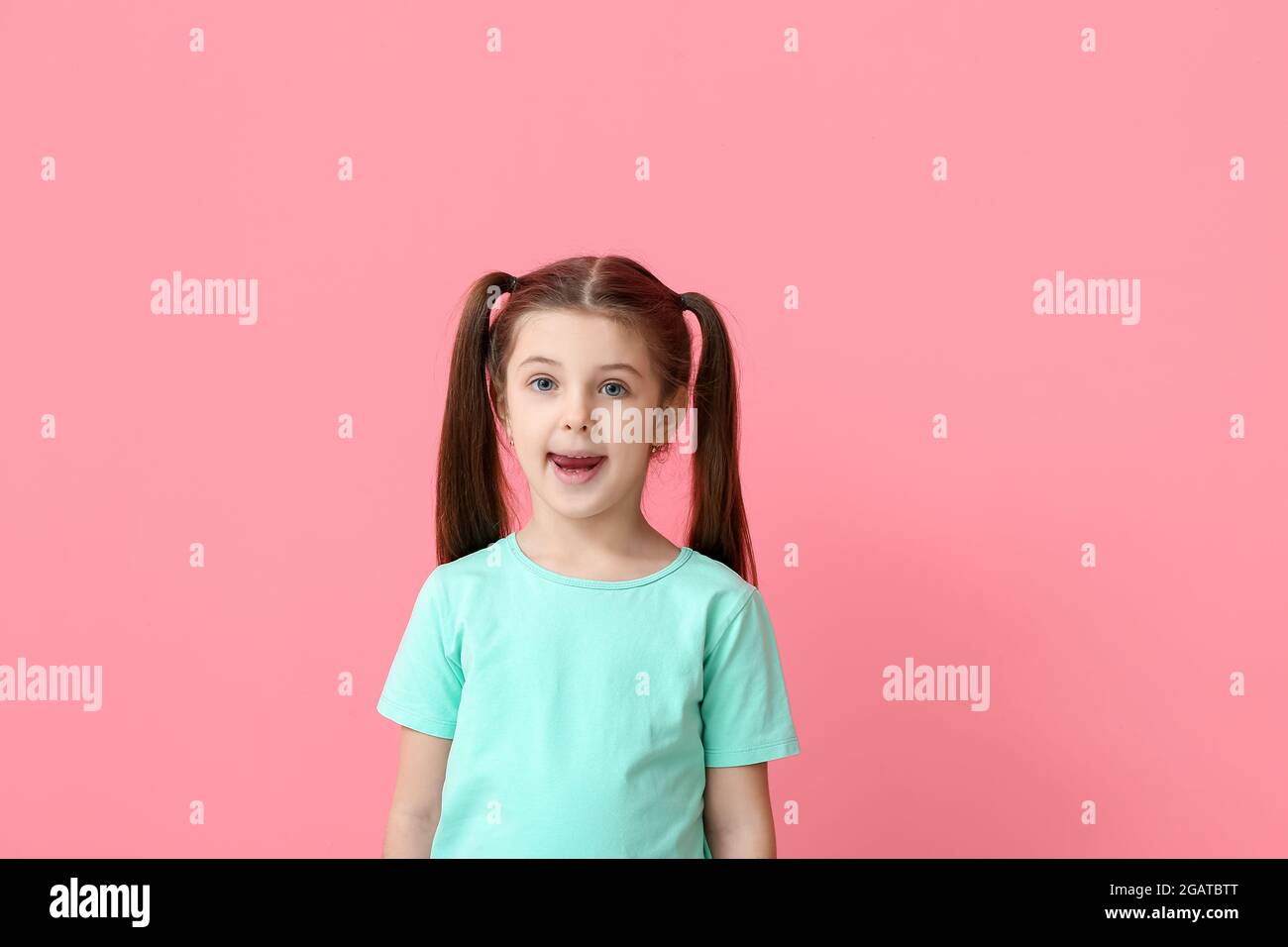 Little girl training pronounce letters on color background Stock Photo ...