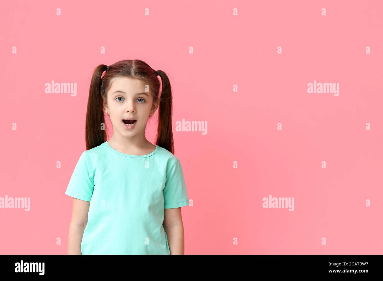 Little girl training pronounce letters on color background Stock Photo ...