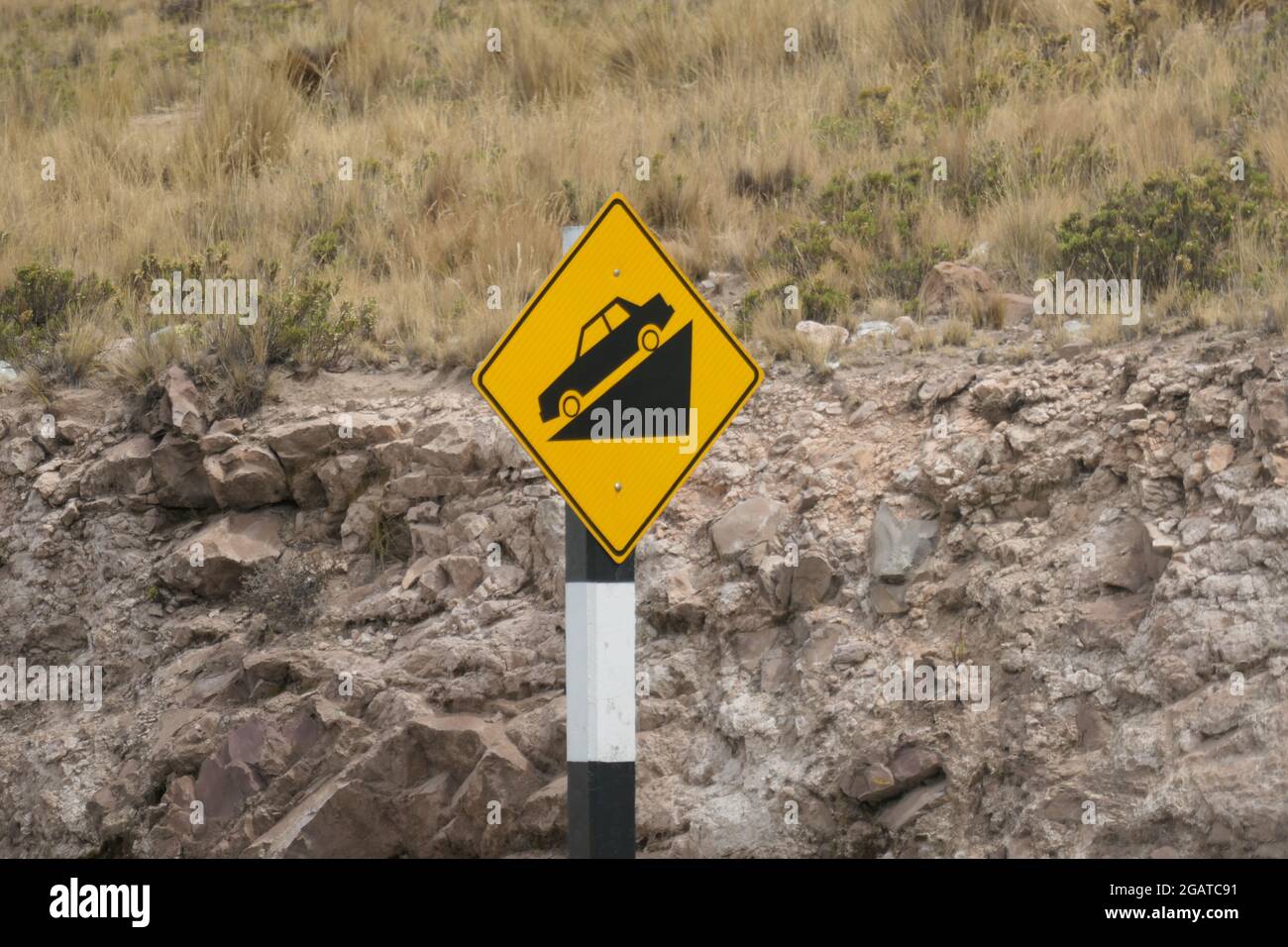 Road sign in Peru hill steep incline path danger dangerous beware slip ...