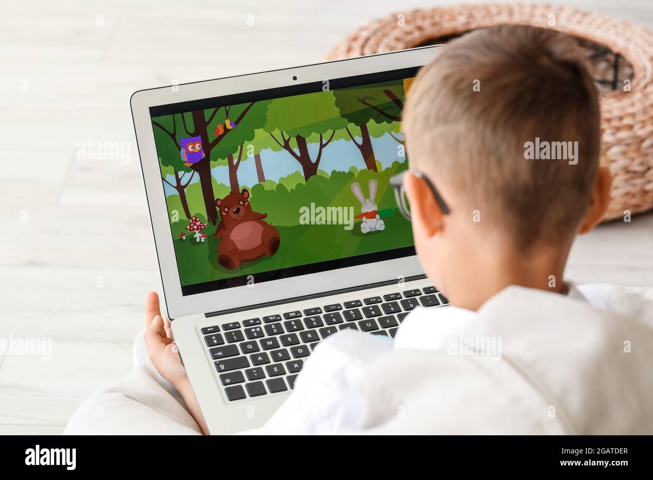 Cute boy watching cartoons at home Stock Photo - Alamy