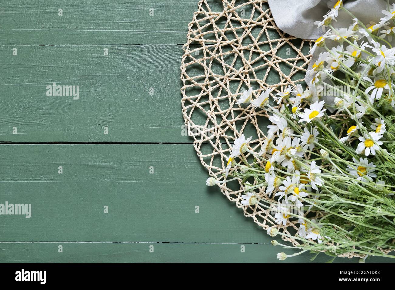 Beautiful chamomile flowers on color wooden background Stock Photo - Alamy