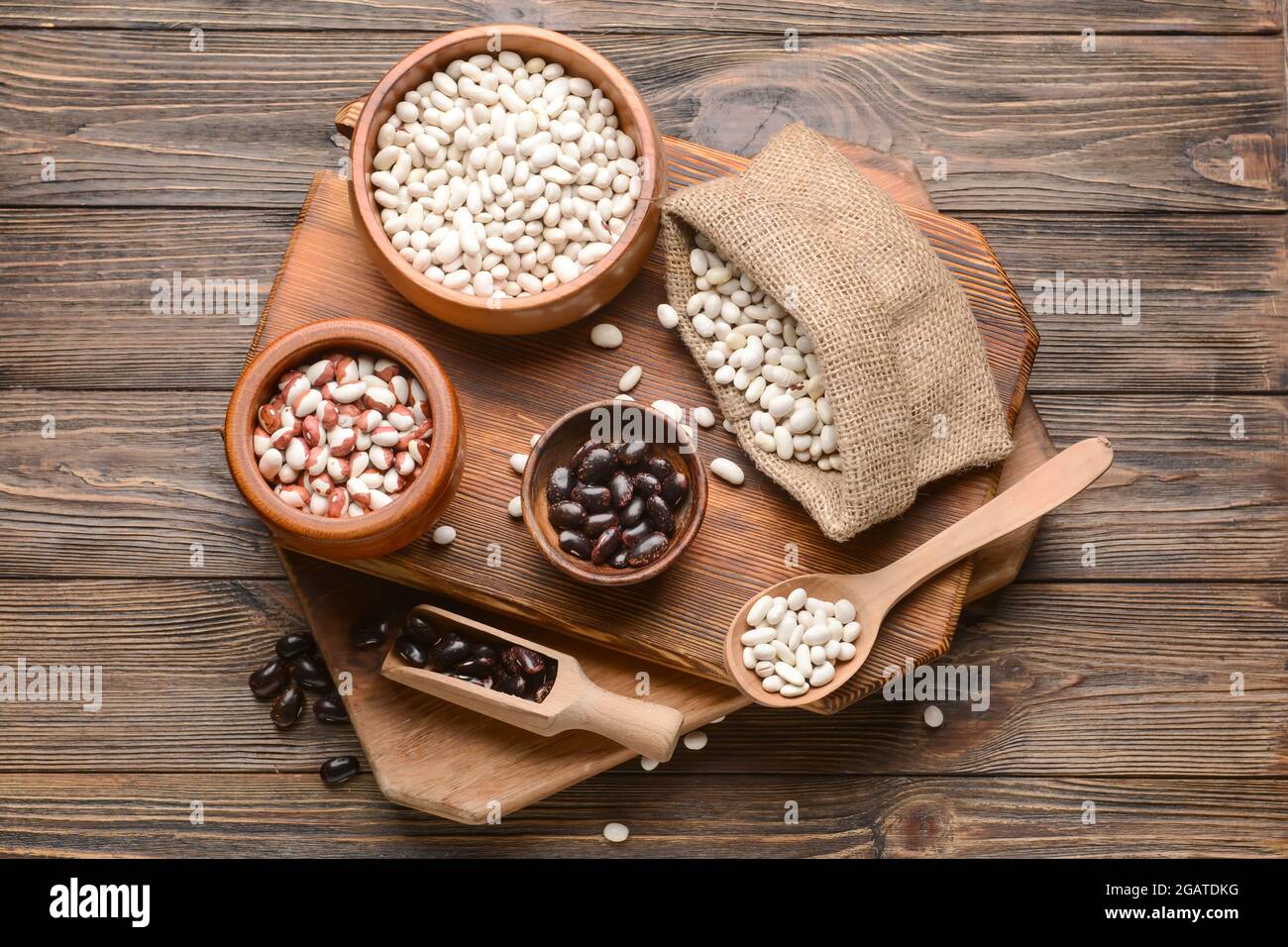 Composition with different types of beans on wooden background Stock ...