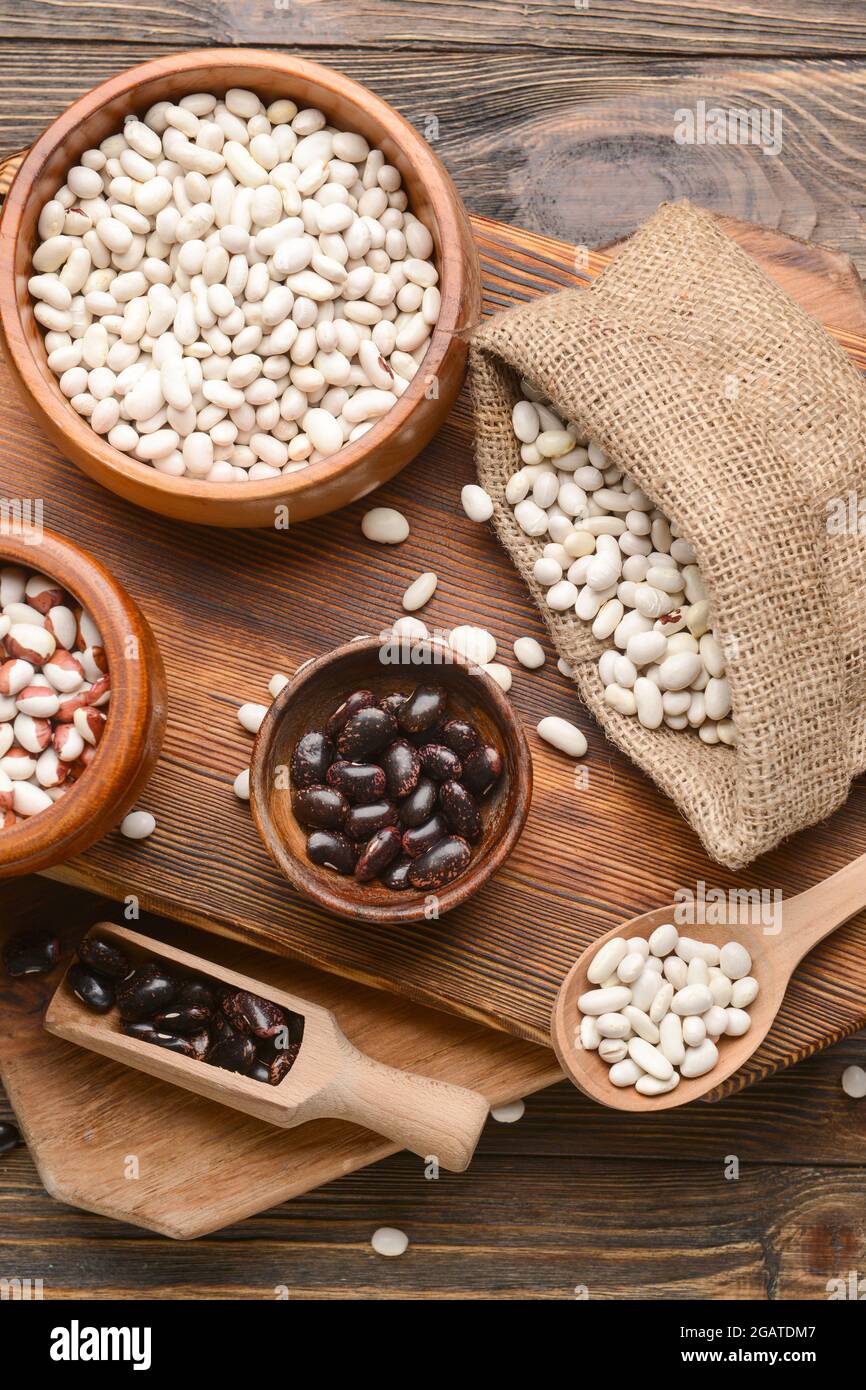 Composition with different types of beans on wooden background Stock ...