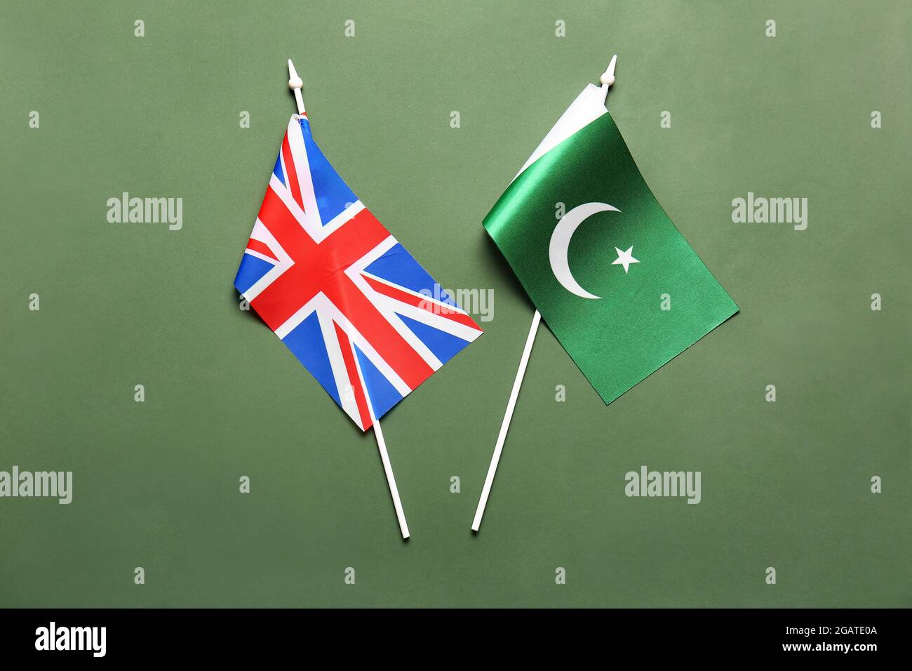 Flags of Pakistan and Great Britain on color background Stock Photo - Alamy