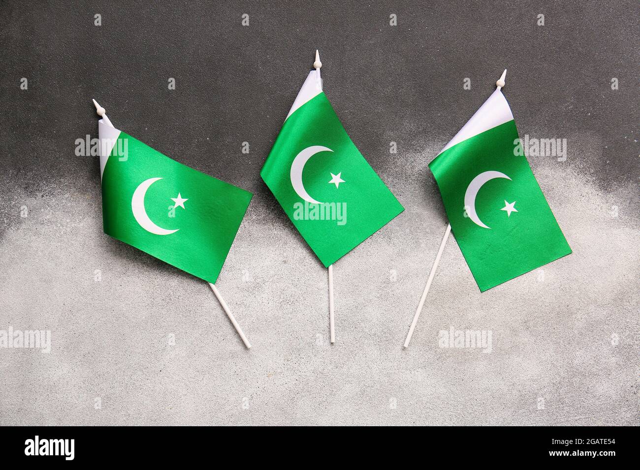 Pakistan flags on black and white background Stock Photo - Alamy