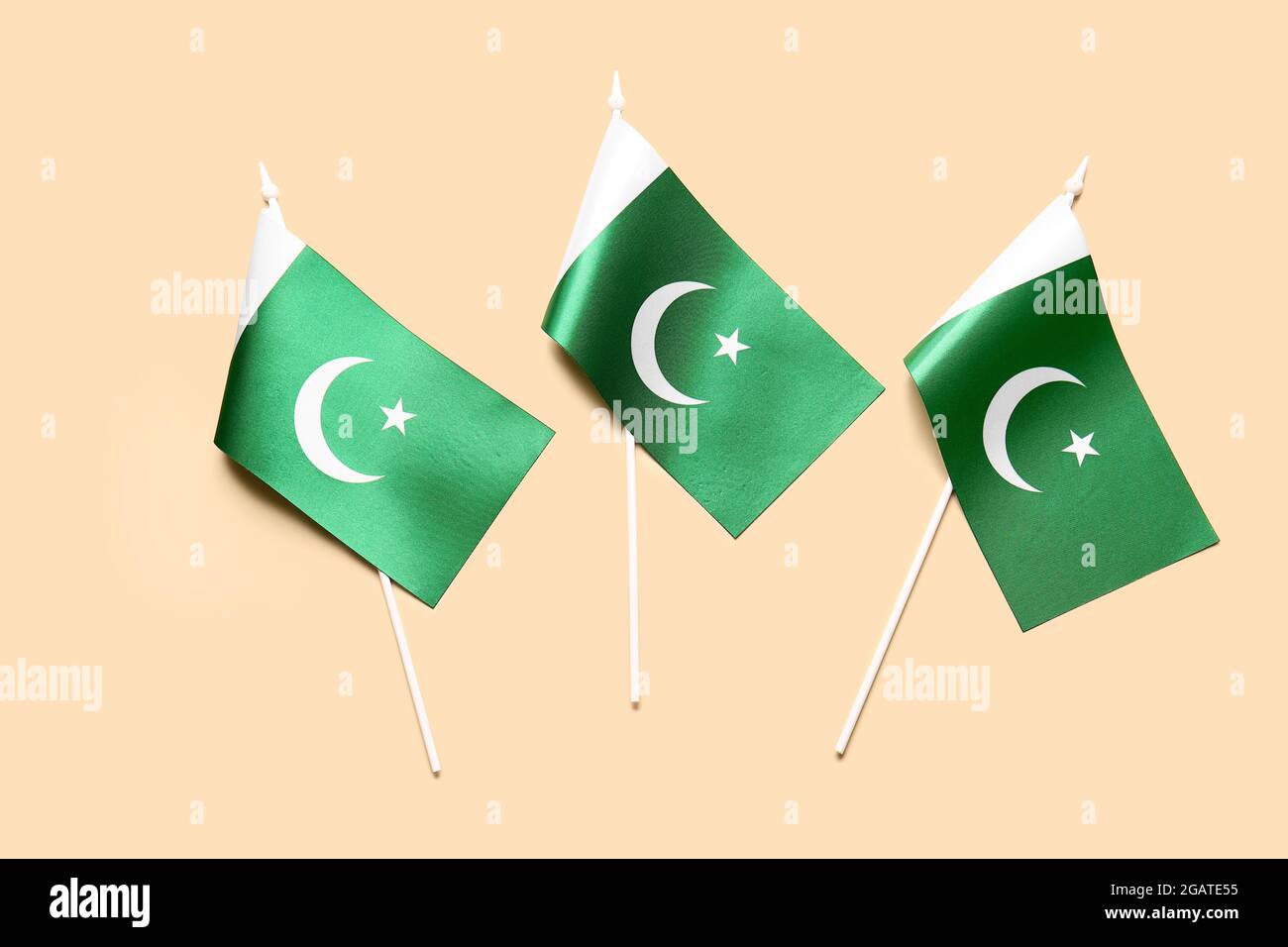 Pakistan flags on color background Stock Photo - Alamy