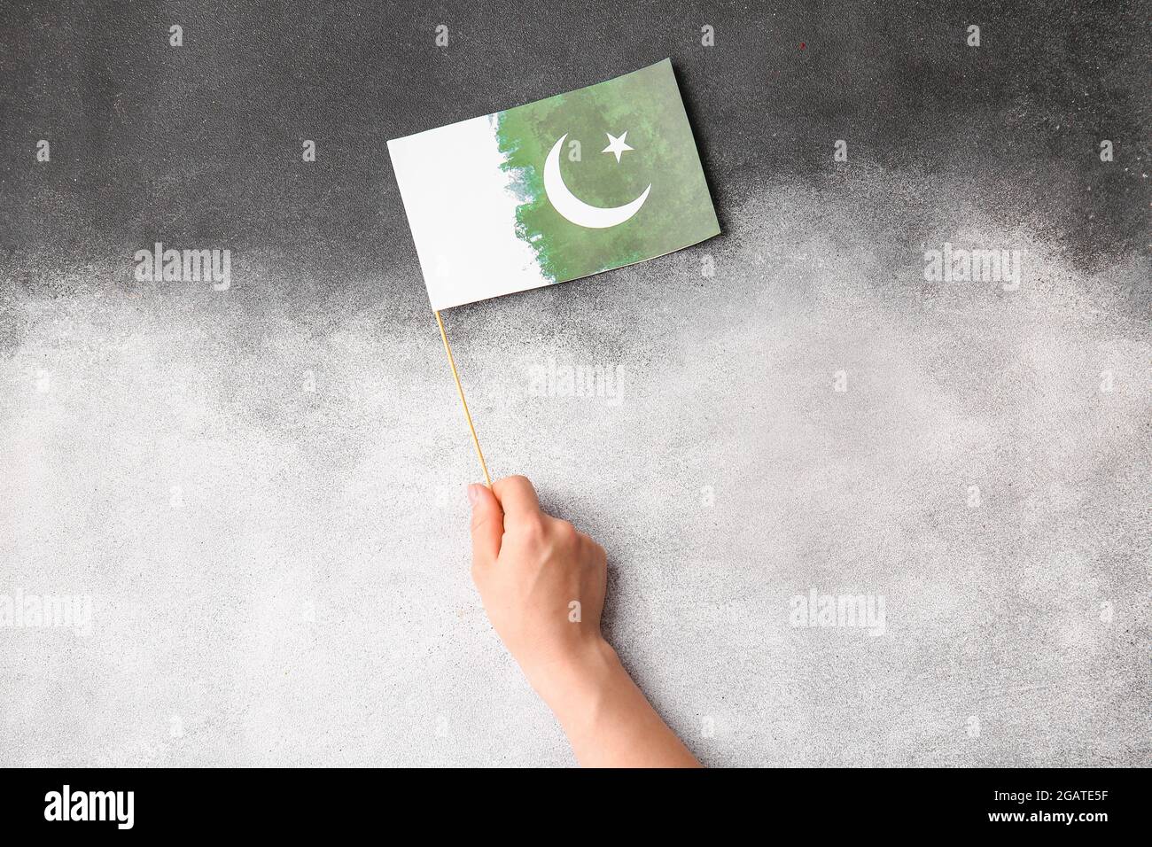 Female hand with Pakistan flag on black and white background Stock ...