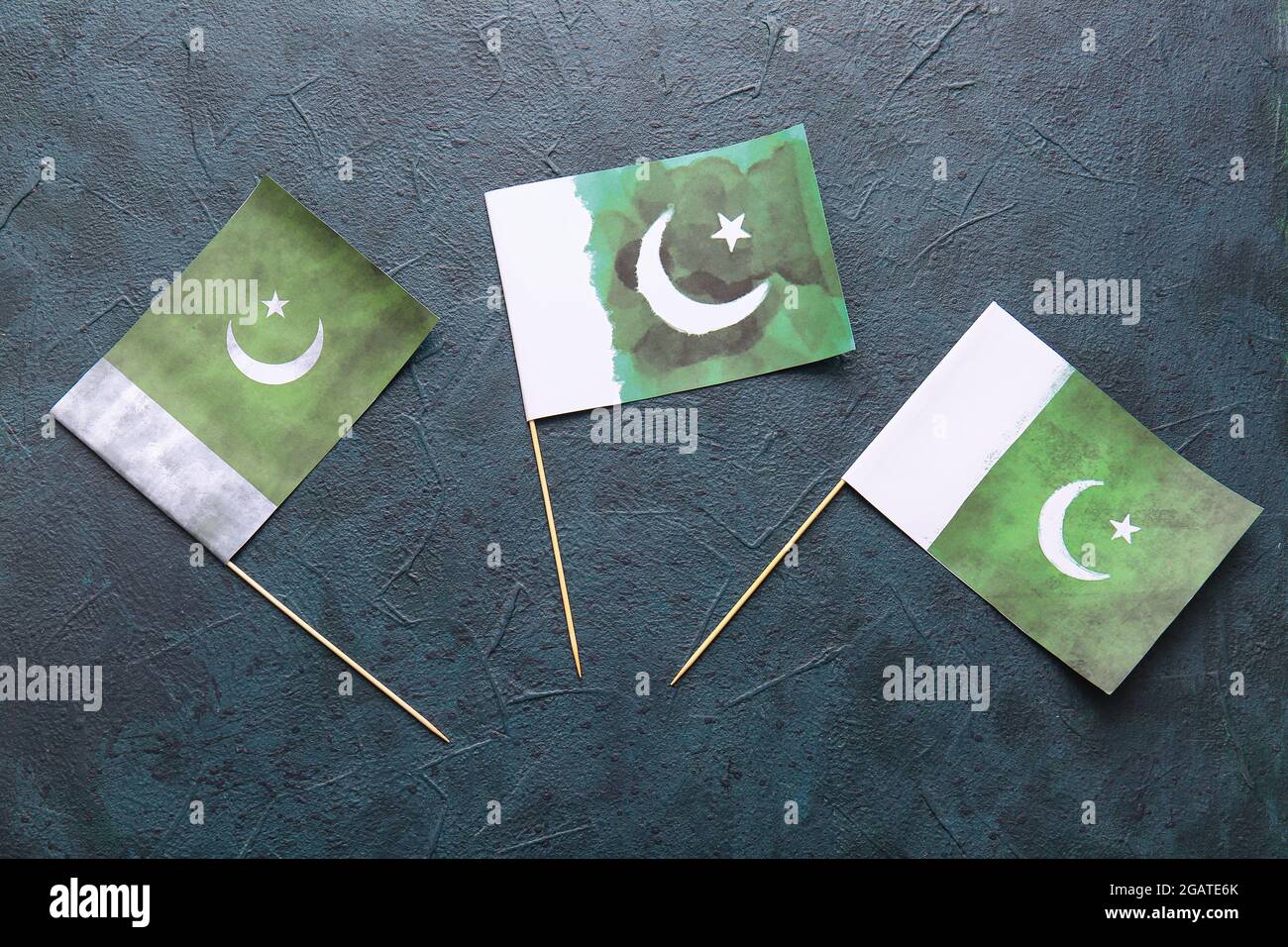 Pakistan flags on dark background Stock Photo - Alamy