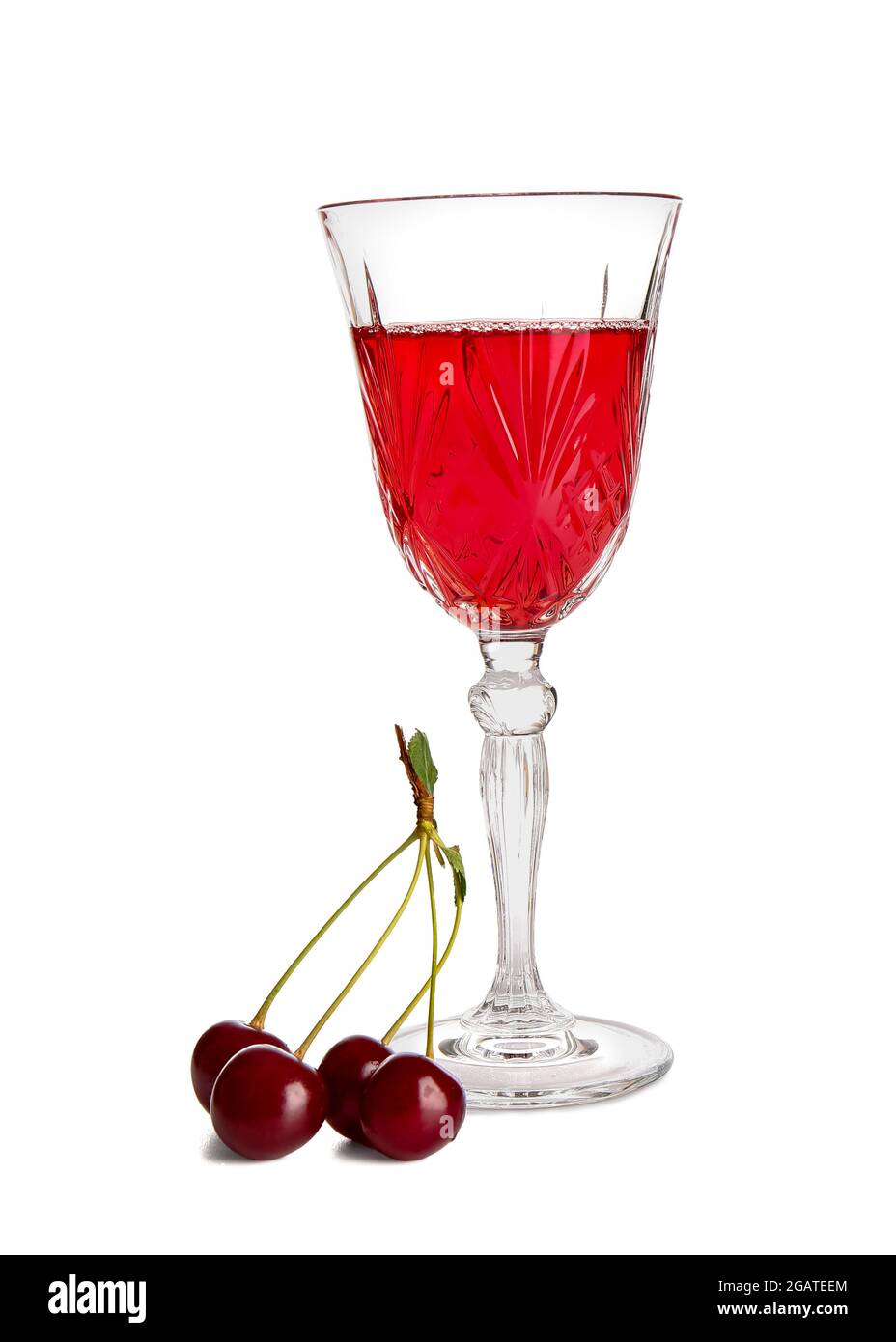 Glass of sweet cherry wine on white background Stock Photo - Alamy
