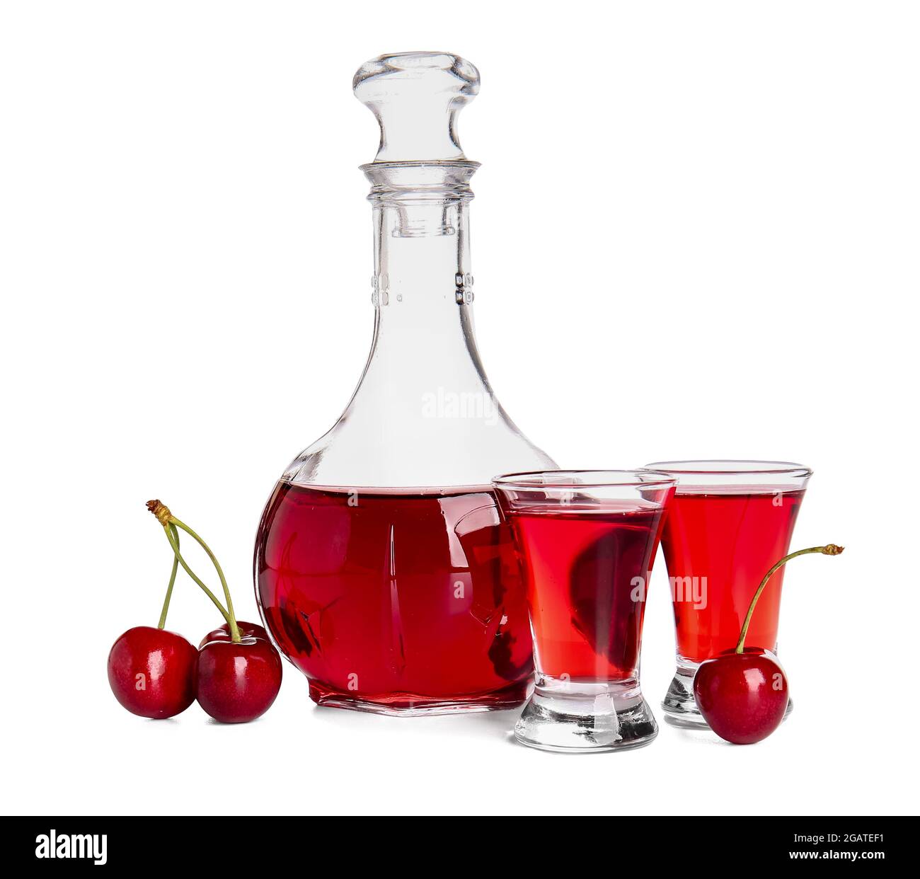 Decanter and glasses of sweet cherry wine on white background Stock ...
