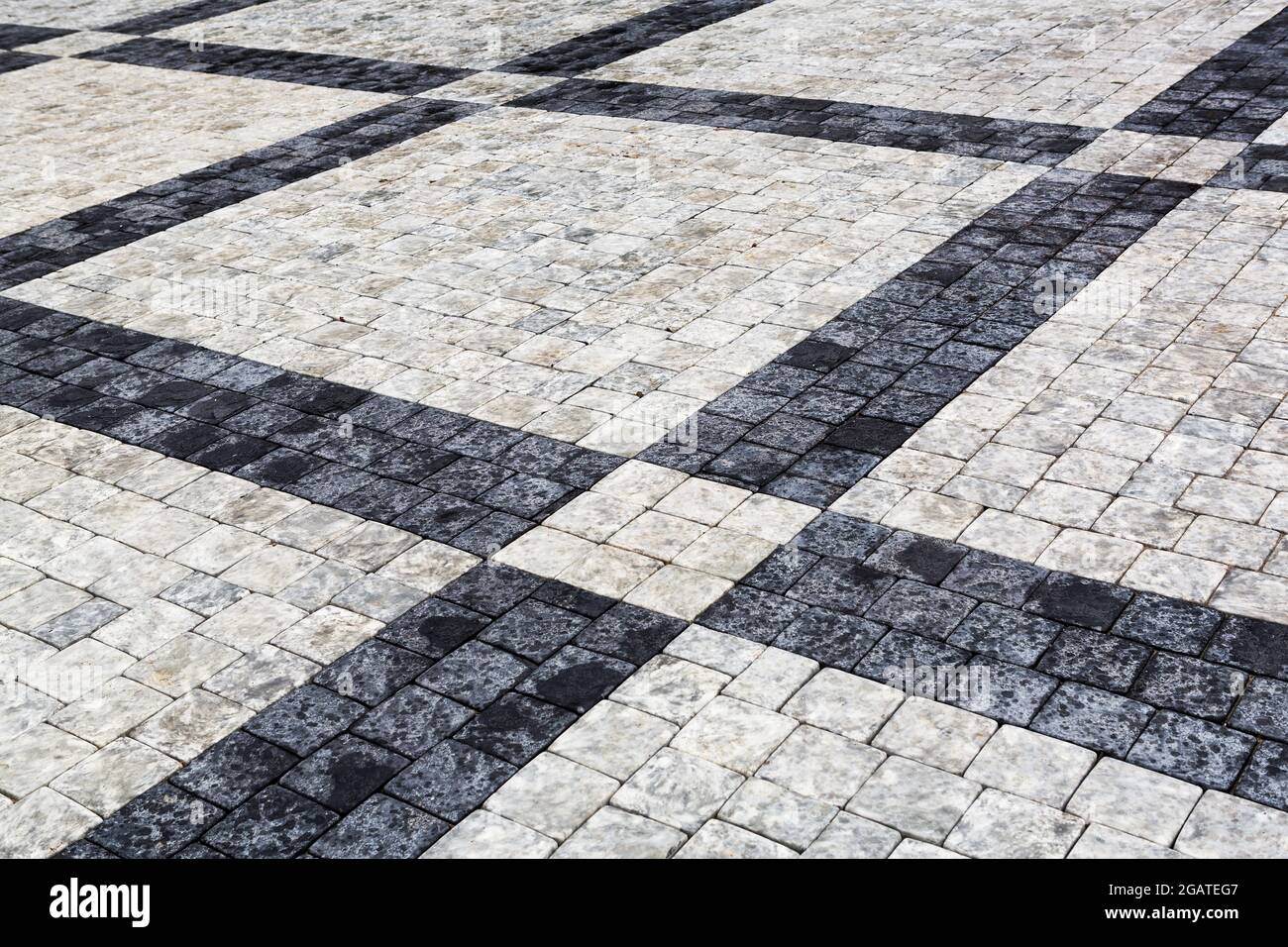 Decorative sidewalk pavement. Tiled floor with gray and black tiles ...