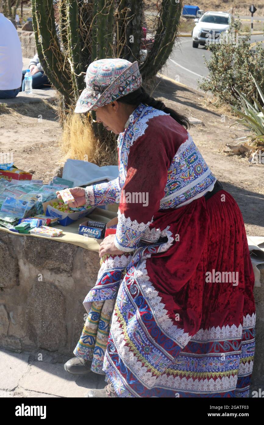 Colca Canyon in Peru selling goods native lady dressed with hat nice ...
