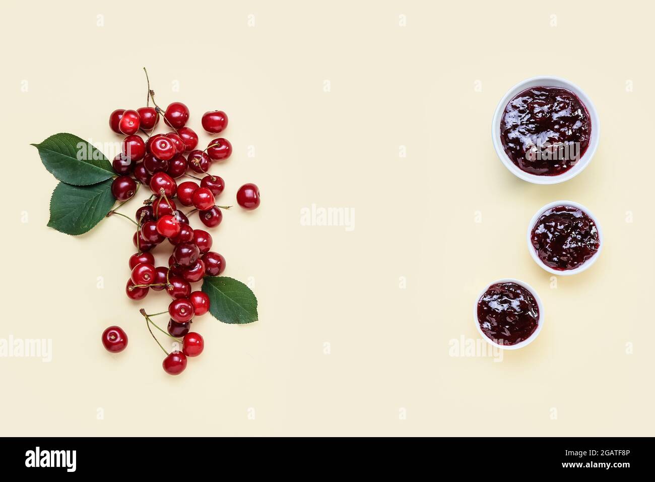 Composition with ripe cherry and jam on color background Stock Photo ...