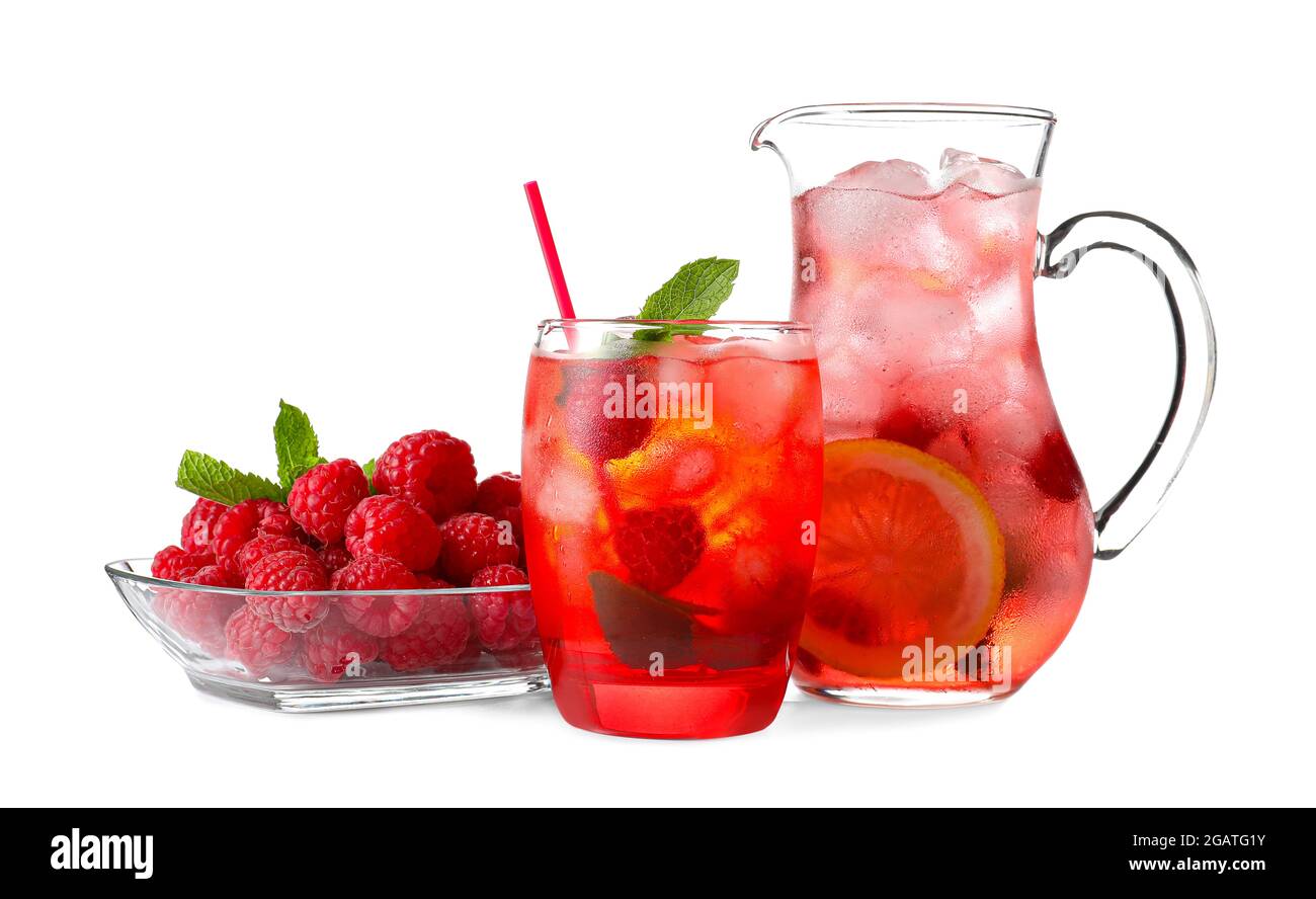 Glass and jug with tasty raspberry lemonade on white background Stock ...