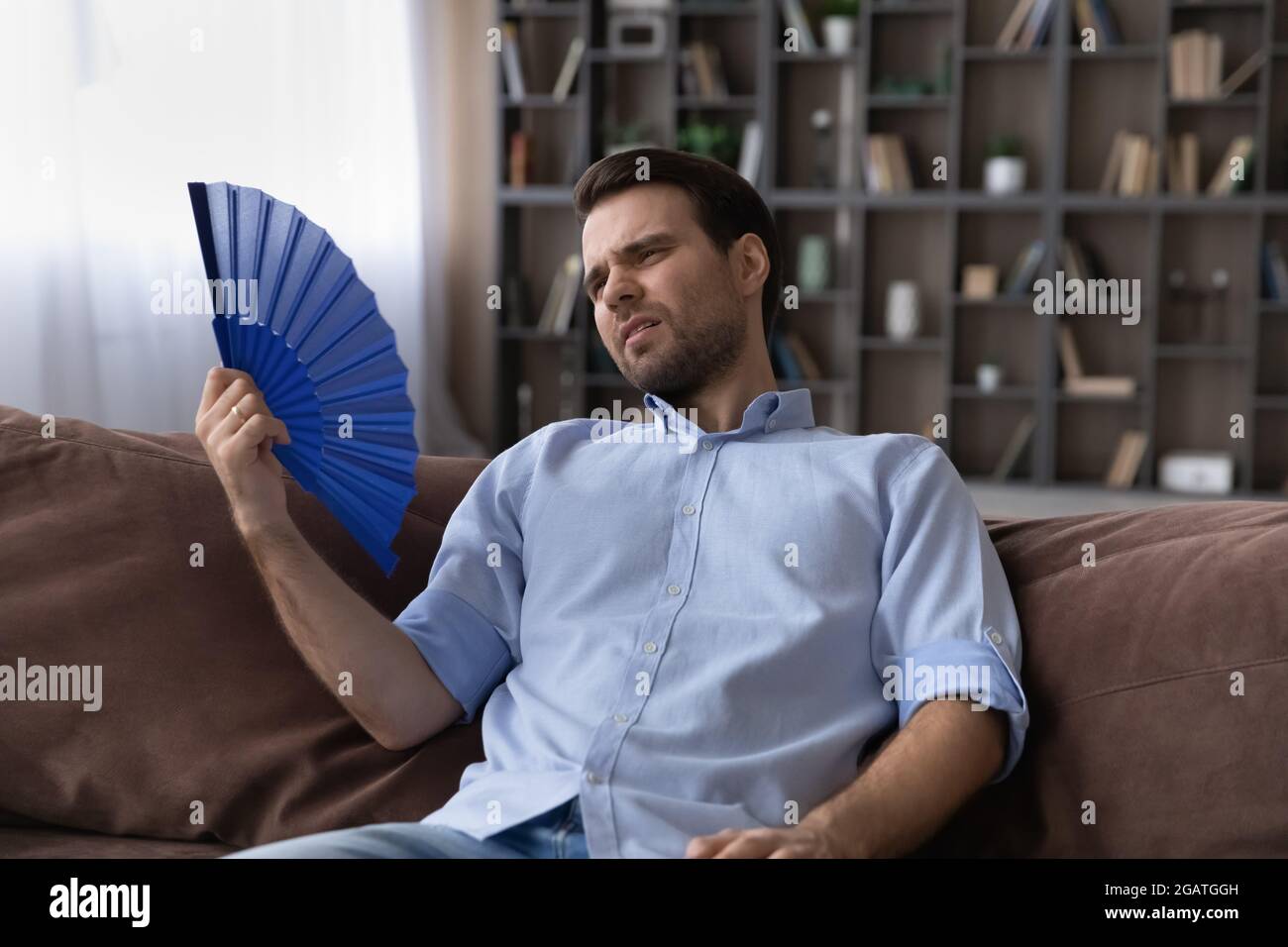 Hot weather man sofa hi-res stock photography and images - Alamy